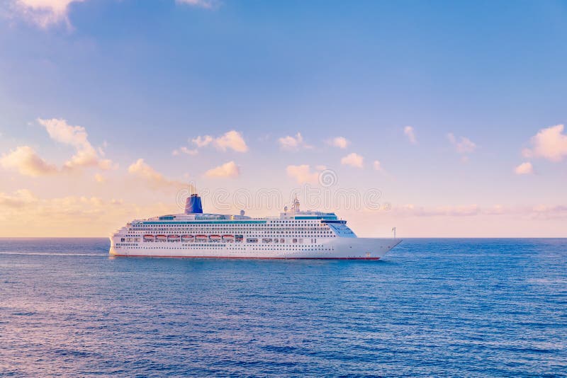Luxury Cruise Ship Sunset in Blue Sea with Clouds Stock Image - Image ...