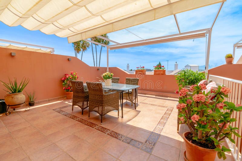 Luxury Garden Rooftop Terrace with Dining Table and Flowers Stock Photo ...