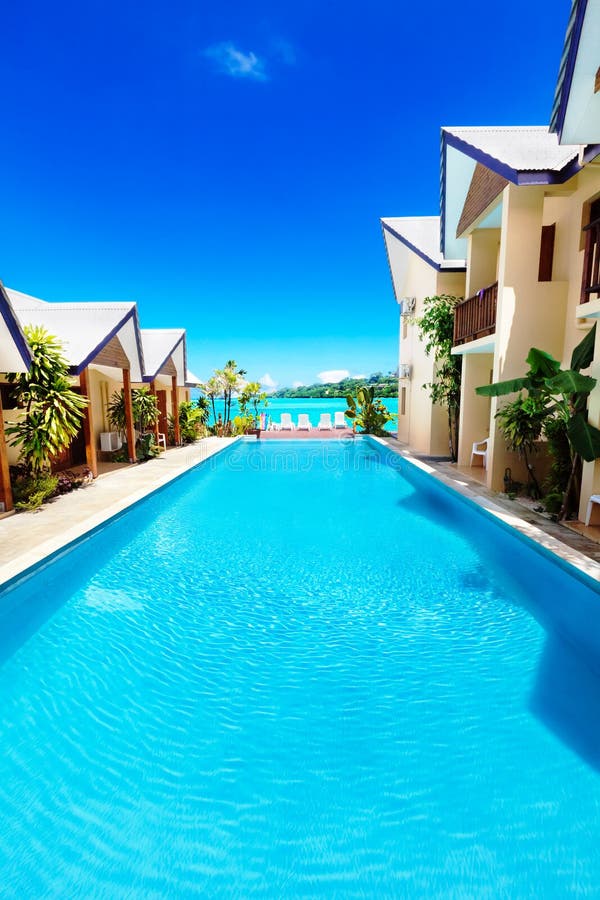 Luxury Hotel Pool by the Sea in the Tropics Stock Photo - Image of ...