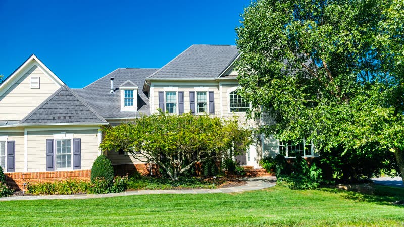 Luxury House in Summer with Green Trees and Nice Landscape Stock Photo ...