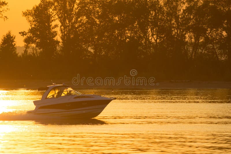 Luxury Motor Boat at Sunset Stock Photo - Image of competition ...