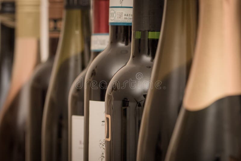 Luxury Wine Bottle in a Row Stock Image - Image of pour, expensive ...
