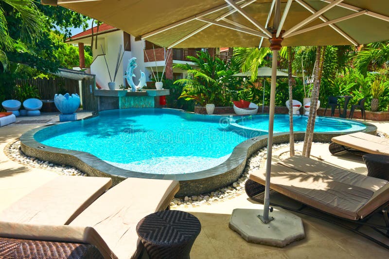 Luxury poolside area stock image. Image of parasol, travel - 50466257