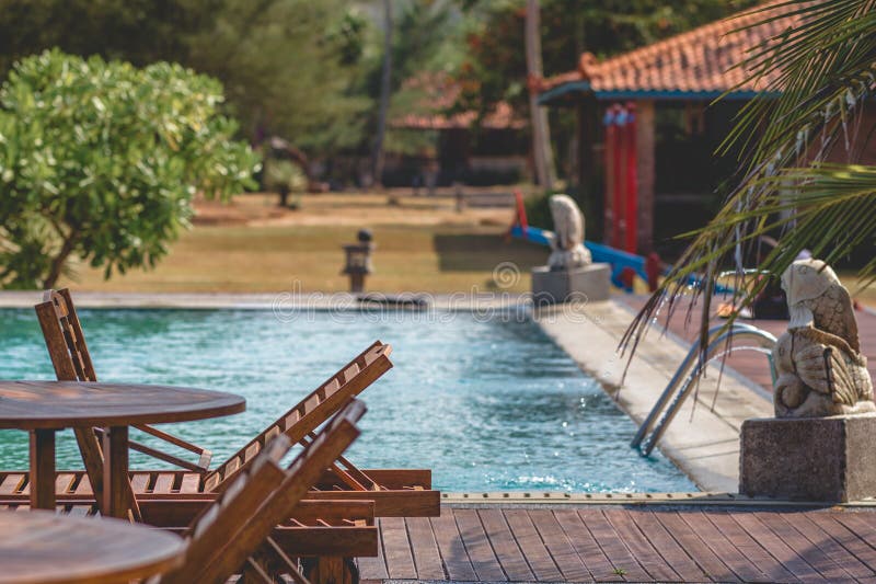 Luxury Poolside Loungers with Scenic View. Beautiful Poolside Oasis ...