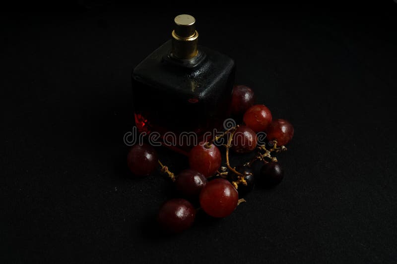 Luxury Red in a Bottle of Perfume Along with Wine Stock Photo - Image ...