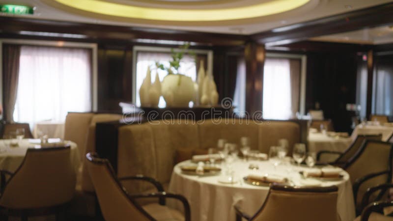Luxury Restaurant with Elegant Table Settings and Plush Seating in a ...