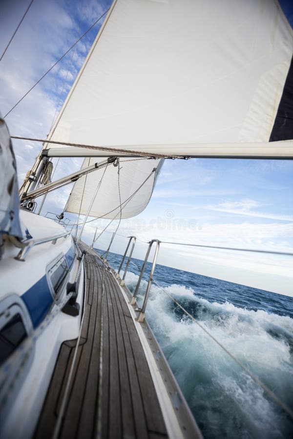 Sail Boat Yacht with Set Up Sails Gliding in Open Sea at Sunrise Stock ...