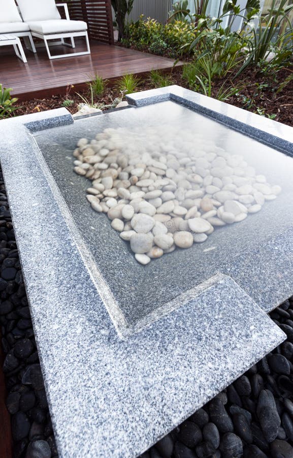 A Luxury Stone Spa Bath at Backyard Stock Photo - Image of blue ...