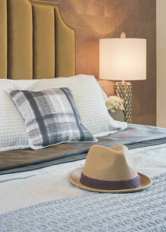Luxury Style Interior Bedroom with Hat at Center of Bed Stock Photo ...