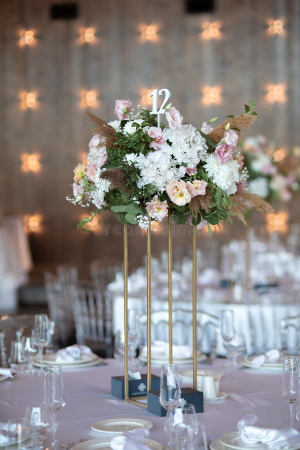 Luxury Wedding Table Setting with Flower Centerpieces and Candles Stock ...