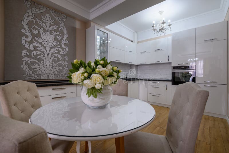 Luxury White Modern Kitchen with Dining Table Stock Photo - Image of ...
