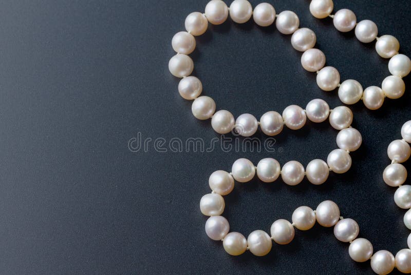 Luxury White Pearl Necklace on a Black Background with Space for Text ...