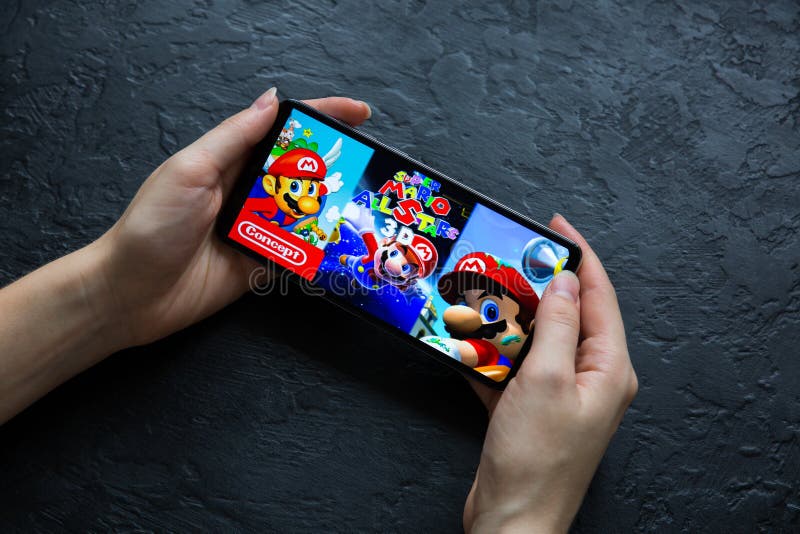 LVIV, UKRAINE - October 25, 2020 : Playing Mobile Game Super Mario on ...