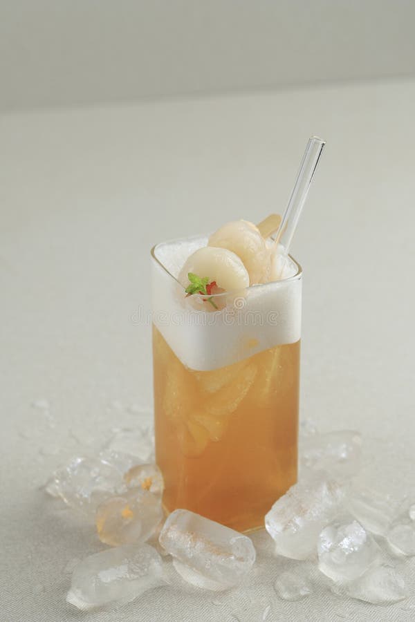 Lychee Iced Tea with Mint Leaves in a Glass with Glass Straw Stock ...