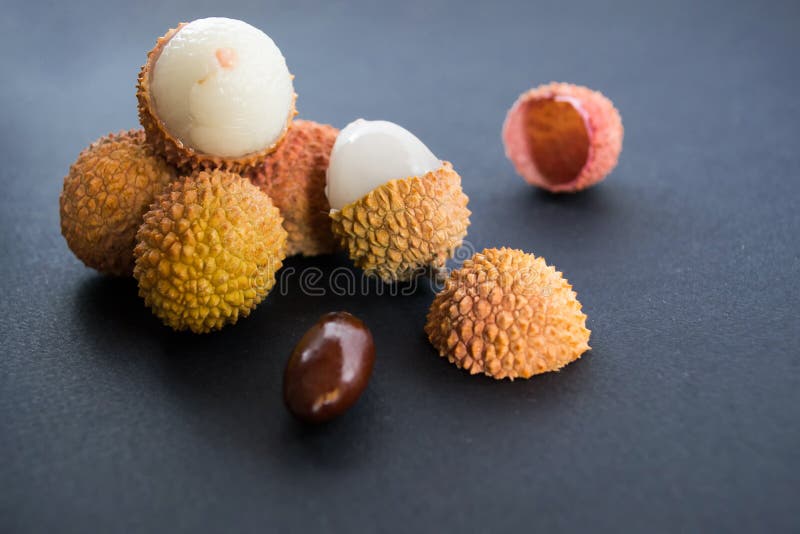 Lychee Litchi with a Stone and Bright, Bumpy Skin on Dark Blue Black ...