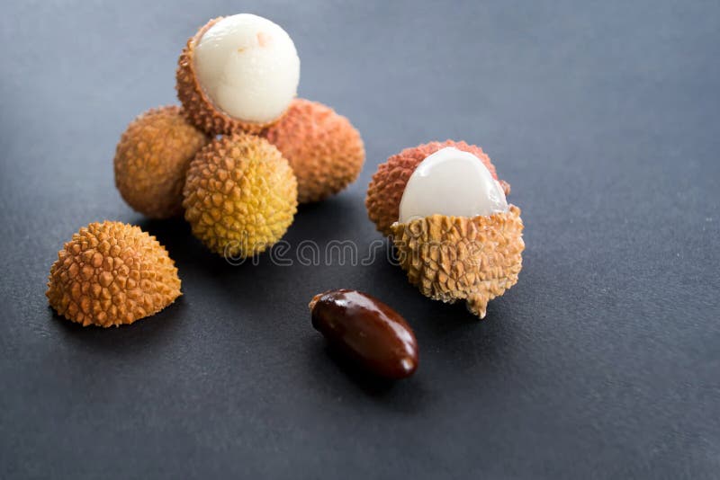 Lychee Litchi with a Stone and Bright, Bumpy Skin on Dark Blue Black ...