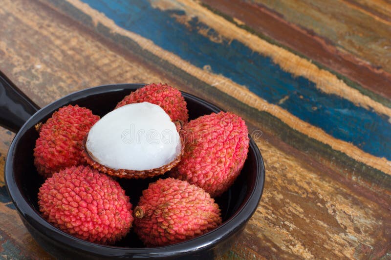 Lychee on a wooden table stock image. Image of litchi - 36833419