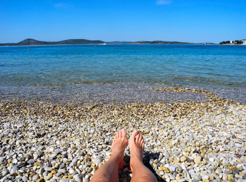 Lying down on the beach. stock photo. Image of clean - 82925846
