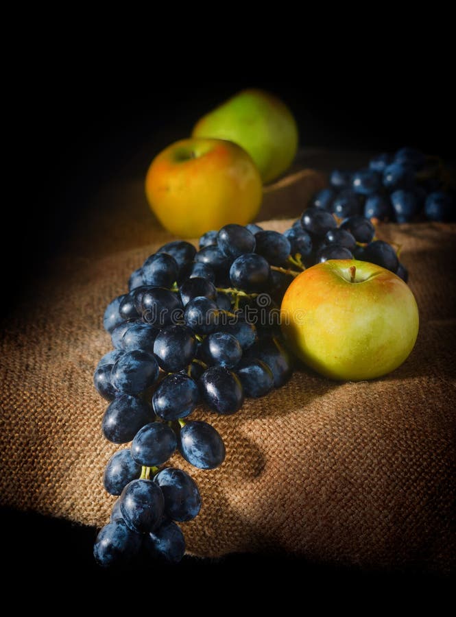Lying Grapes Snake on a Burlap with Apples. Stock Photo - Image of diet ...