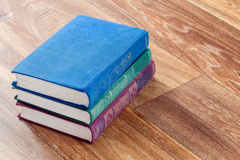 The Lying Multi-colored Books on a Wooden Table. Stock Image - Image of ...