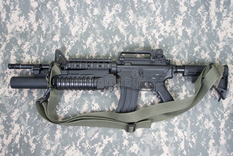 An M4A1 Carbine Equipped with an M203 Grenade Launcher Stock Photo ...