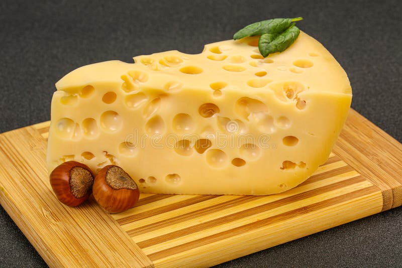 Maasdam Cheese - Yellow Triangle with Holes Stock Photo - Image of ...