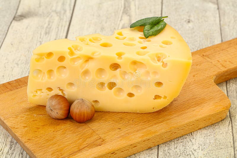 Maasdam Cheese - Yellow Triangle with Holes Stock Photo - Image of ...