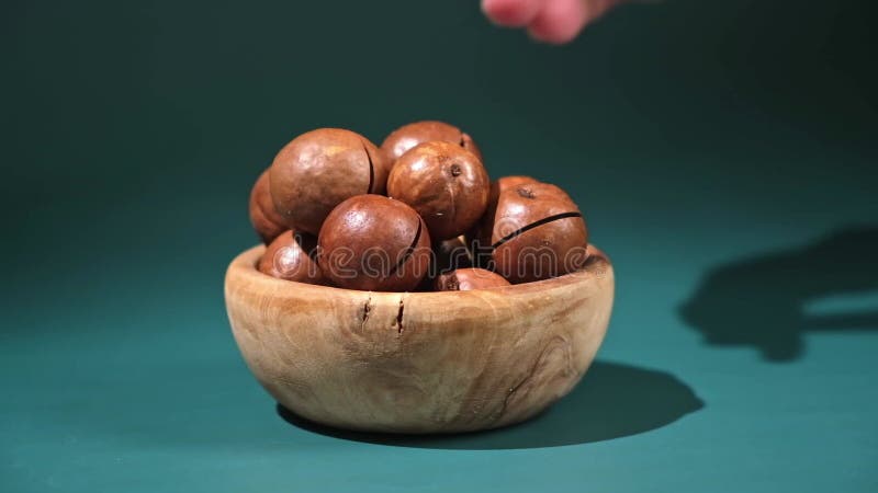 Macadamia Nuts with a Key on Turquoise Background Stock Footage - Video ...