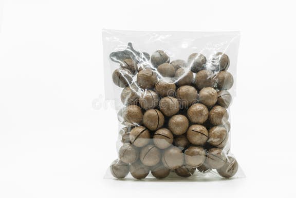 Macadamia Nuts in Shell and Cracker Tool in Cleared Plastic Packaging ...