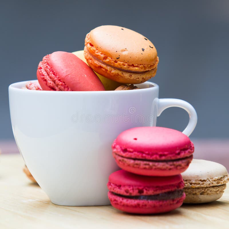 Macaron in coffee cup stock photo. Image of dessert, confectionery ...