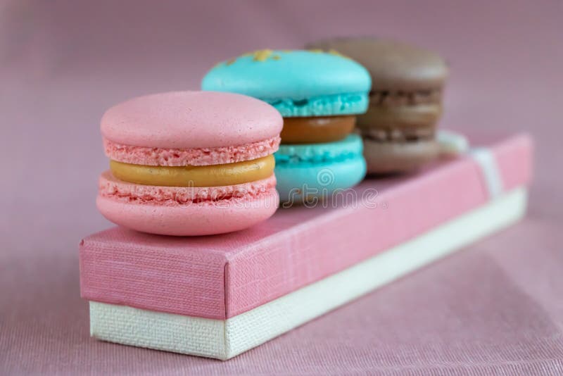 Macarons with Cream in Pastel Colors. Stock Photo - Image of hand ...