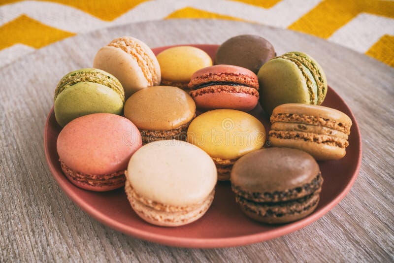 Macarons on plate stock photo. Image of caramel, sweet - 221588956