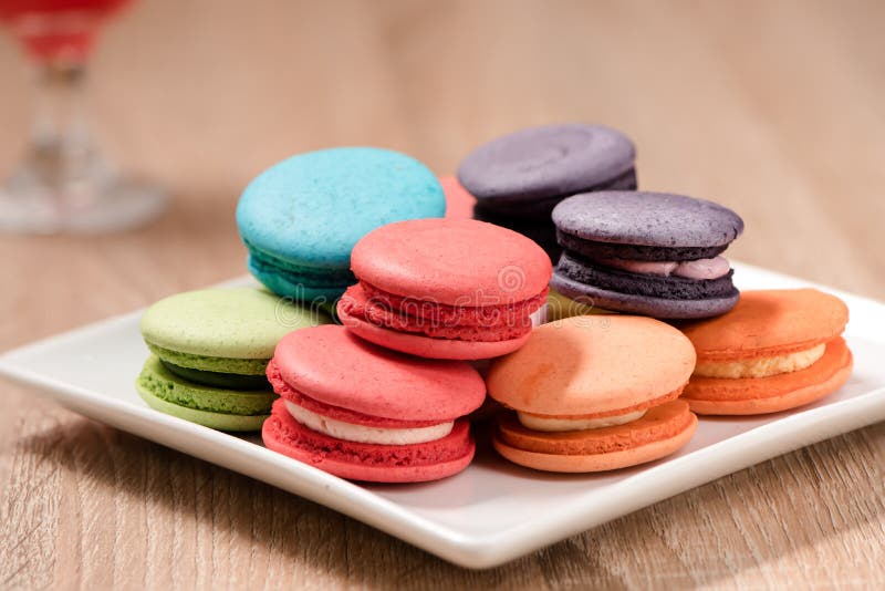 Macarons in Plate on Wood Table Stock Image - Image of dessert, biscuit ...