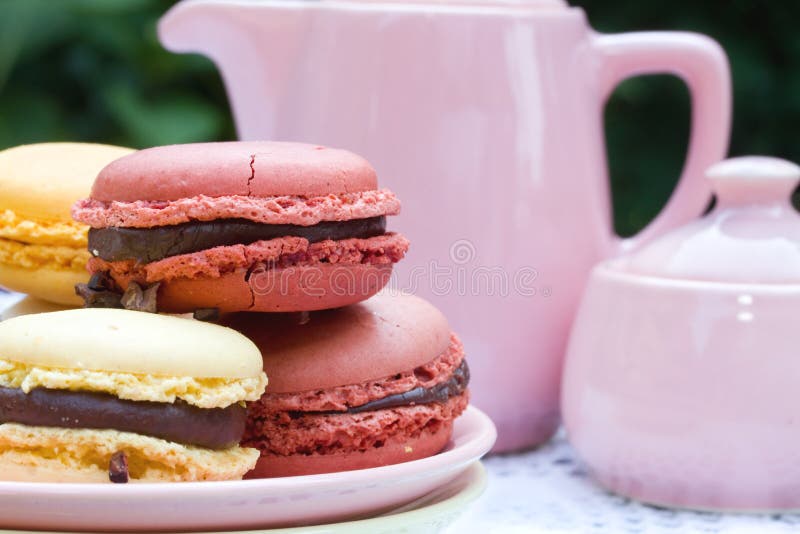 Macarons and teapot stock image. Image of confectionery - 33504543