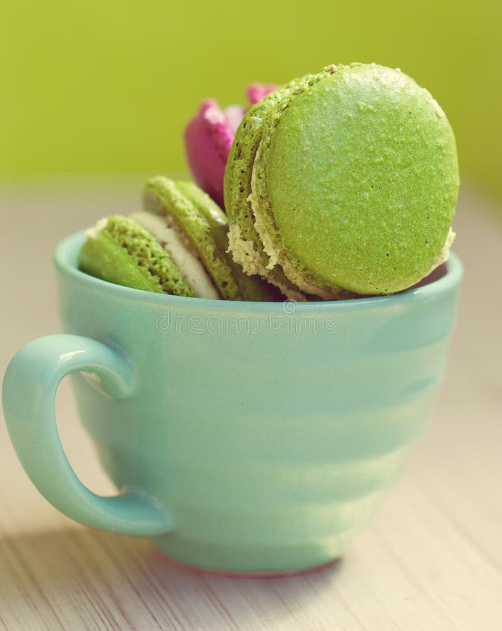 Macaroons in Cup on Wooden Table Stock Image - Image of stack ...