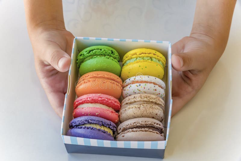 French Multi-colored Cookies Makoorons on a Yellow Background Stock ...