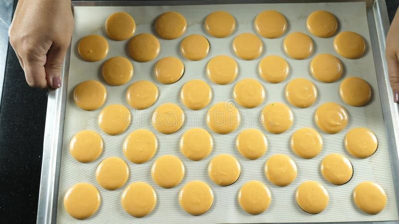 Macaroons Squeeze Pastry Cream or Dough on the Form on a Baking Tray ...