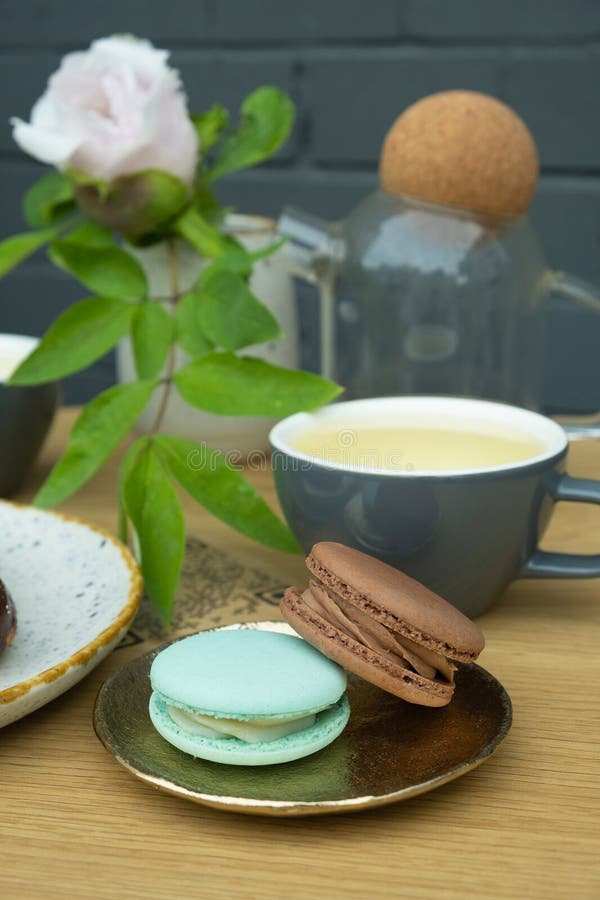 Macaroons on a Table with Tea Cup in a Cafe. Sweet Food Still Life ...