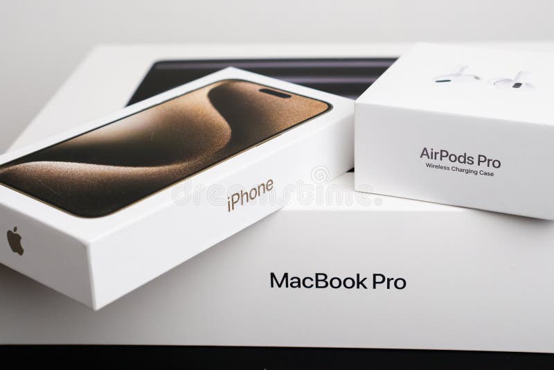 MacBook Pro, IPhone and AirPods Pro Boxes on a Table. Editorial Stock ...