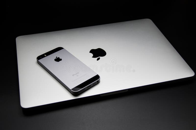Macbook Pro 2016 Touch Bar and Iphone SE on Top Editorial Stock Image ...