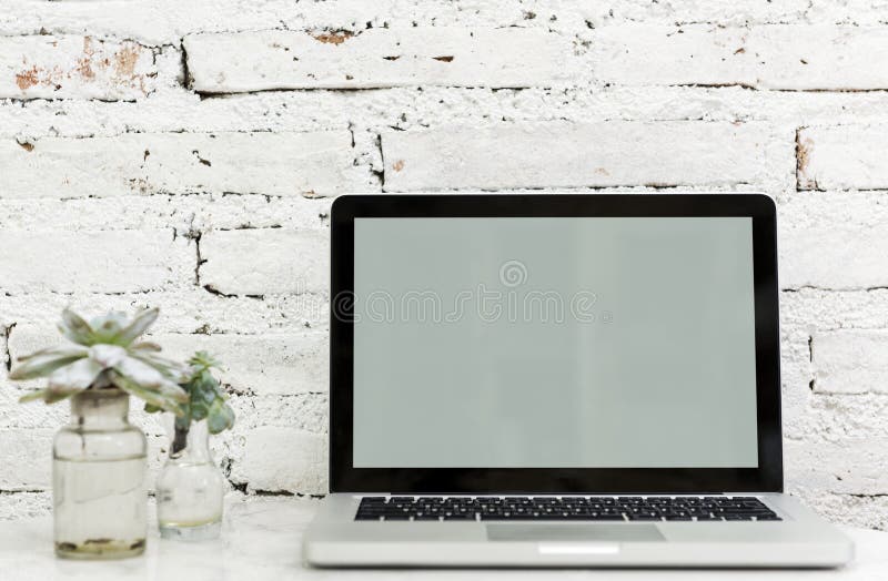 Macbook Pro On White Surface Picture. Image: 109915363