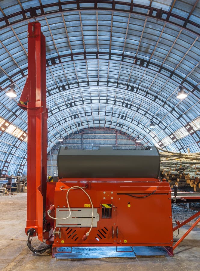 Machine for Chopping Firewood. Firewood Processor in Big Warehouse ...