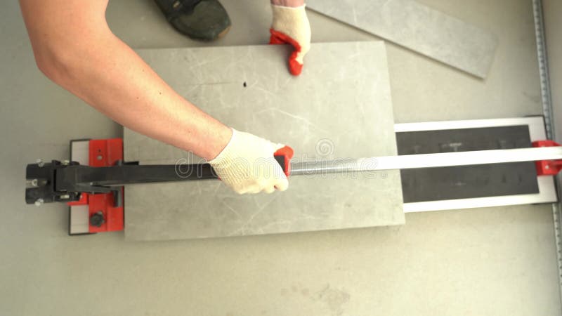 A Jack-of-all-trades Who Uses a Machine when Working with Tiles. a ...