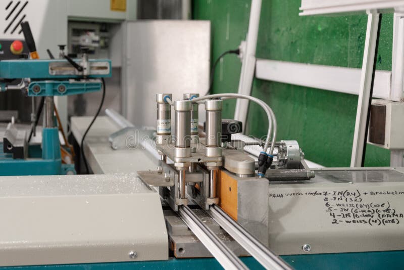Machine Cutting Pvc Profile. Production of PVC Windows, a Section of ...