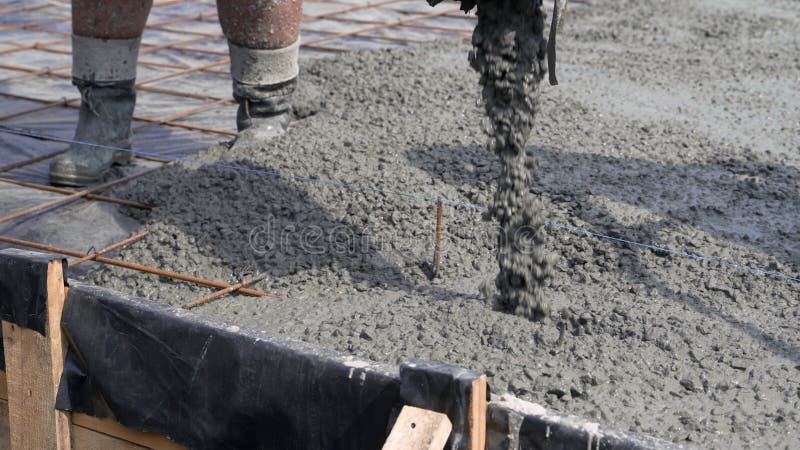 Machine Feeding Concrete through a Pipe for Pouring the Foundation of a ...