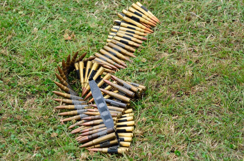 Bullets on Ground with Man Aiming Machine Gun Stock Image - Image of ...