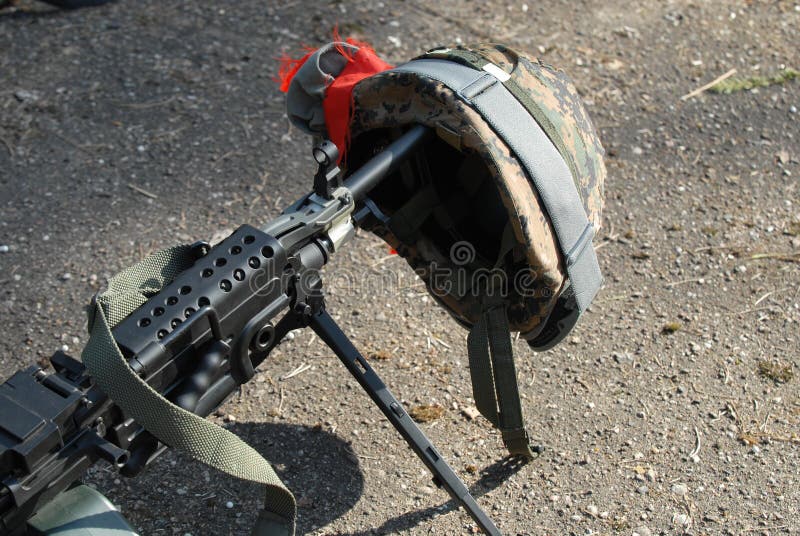 Machine gun and helmet stock image. Image of killing, shooting - 5034643