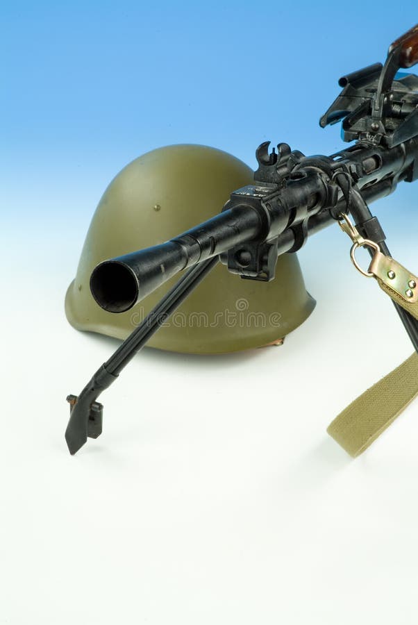 Machine Gun and Helmet stock photo. Image of design - 203538066