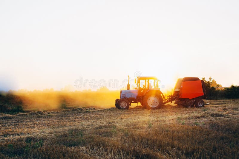 A Machine that Makes Hay in a Circle Stock Photo - Image of hayfield ...