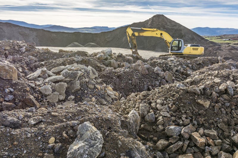 Machine Moving Rock into a Quarry To Transform into Gravel Stock Image ...